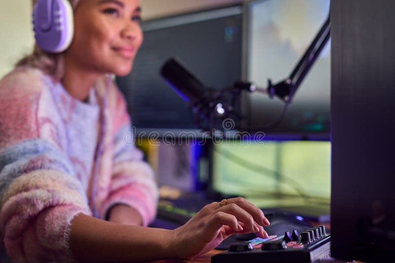 Woman Gaming at Home Sitting at Desk with Multiple Monitors Stock Photo ...
