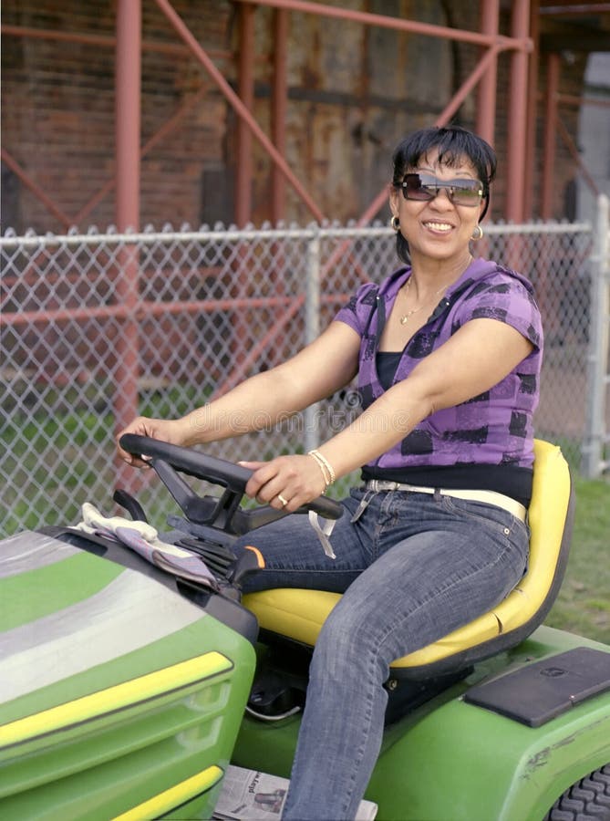 Woman on Garden Tractor editorial image. Image of landscaper - 9217635