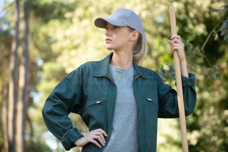 Woman Gardener Holding Rake Stock Photo - Image of green, agriculture ...