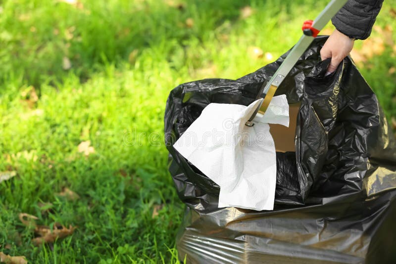 Trash Grabber Picking Up A Can Stock Photo - Image of clean, squeeze ...