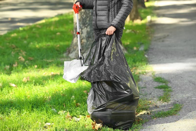 Woman Gathering Trash in Park Stock Image - Image of ecology, concept ...