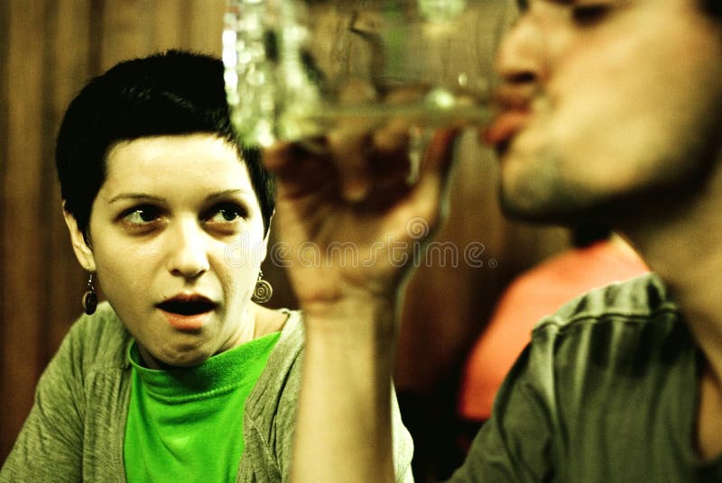 Woman Gawking at Man Drinking Stock Photo - Image of appalled, shocked ...
