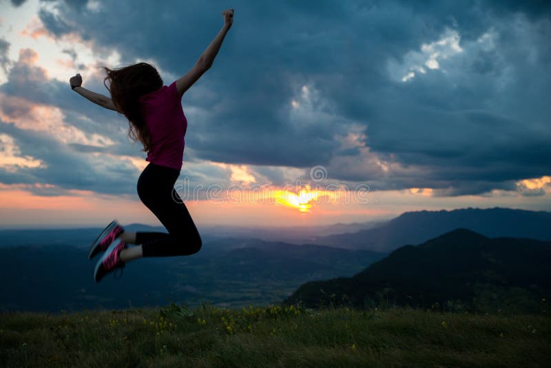 Woman Gesturing Success - Silhouette Over Evening Sky Stock Photo ...