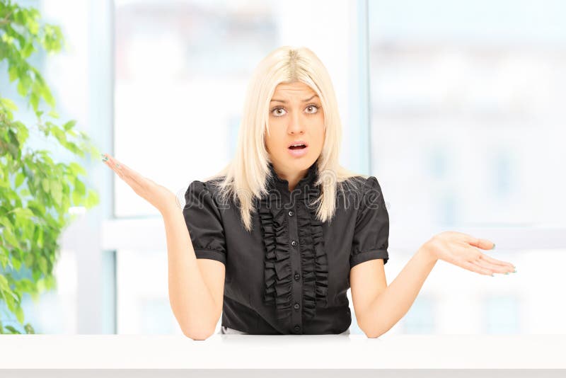 Woman Gesturing Uncertainty Seated at Home Stock Image - Image of room ...