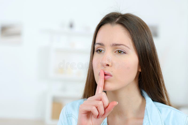 Woman Gesturing Us To Be Quiet Stock Image - Image of hand, hush: 122439135