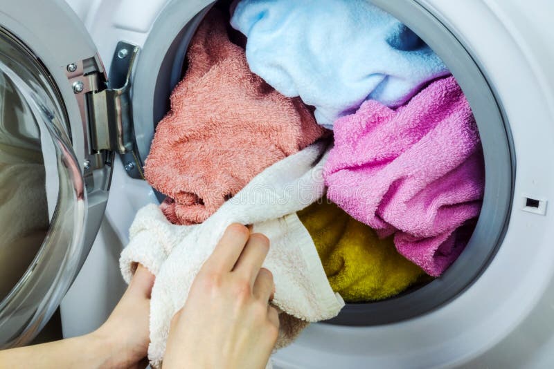 Woman Gets Clothes from the Washing Machine Stock Photo - Image of ...