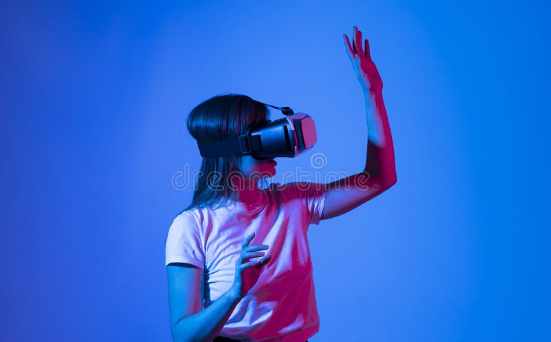 Woman Getting Experience in Metaverse Using VR Headset Glasses ...