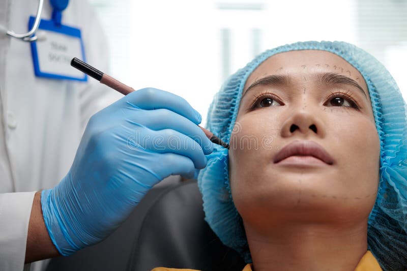 Woman Getting Face Marked stock photo. Image of face - 287462516