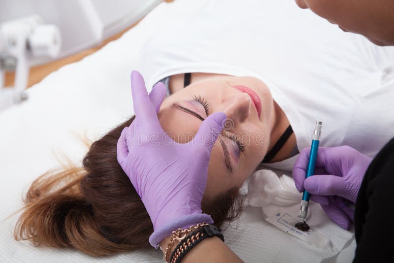 A Woman Getting Permanent Make Up Stock Image - Image of horizontal ...