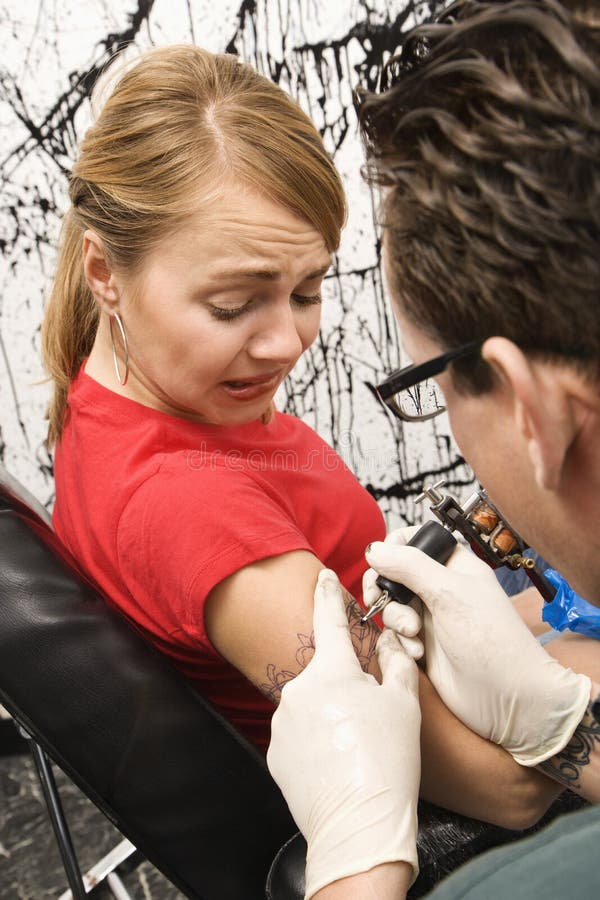 Woman getting tattoo. stock image. Image of male, creative - 2677575