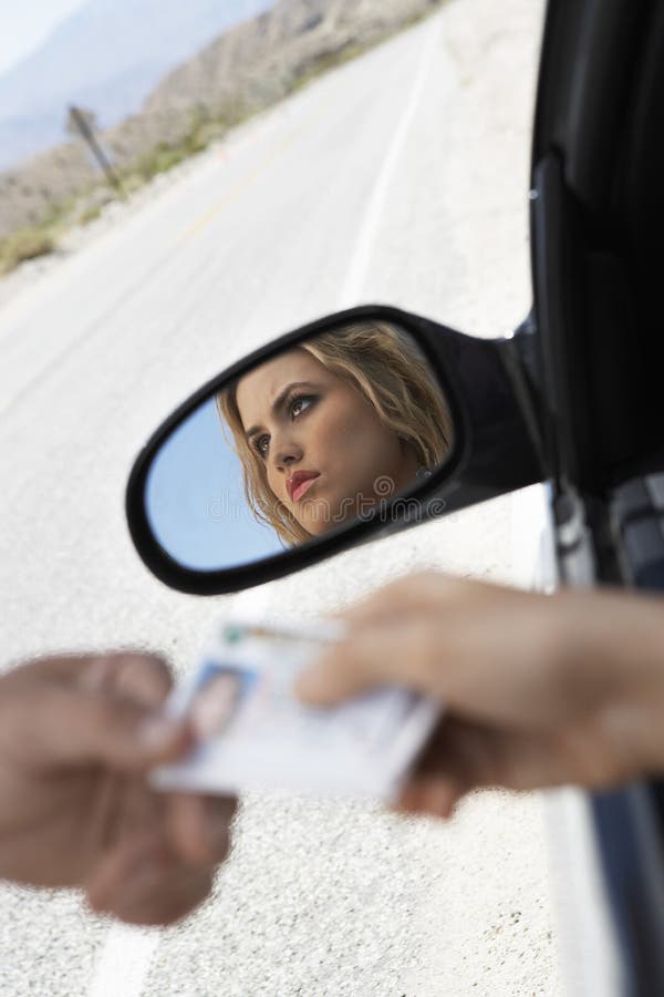 Woman Giving Her License To the Cop Stock Image - Image of angry ...