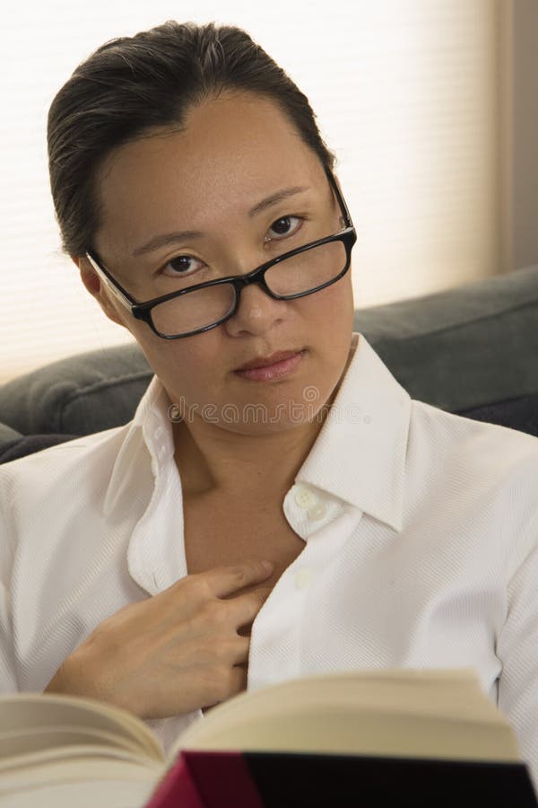 Woman Glances Up from Her Book Stock Image - Image of doctor, diploma ...