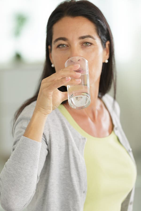 Woman with glass water stock image. Image of wellbeing - 218239413
