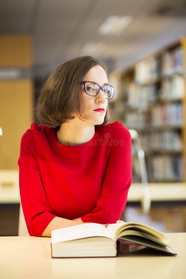 Woman with Glasses in Library Look Around Stock Photo - Image of book ...