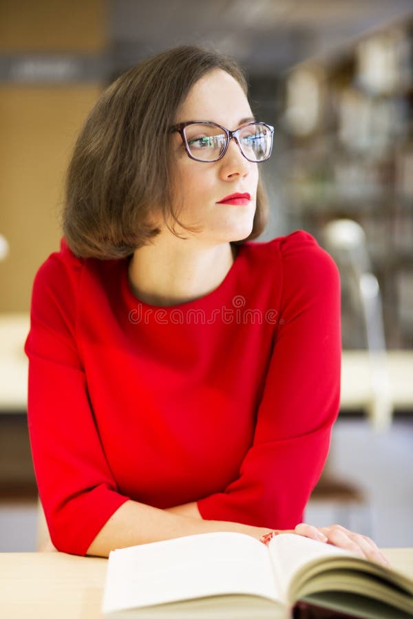 Woman with Glasses in Library Looking Left Stock Image - Image of book ...