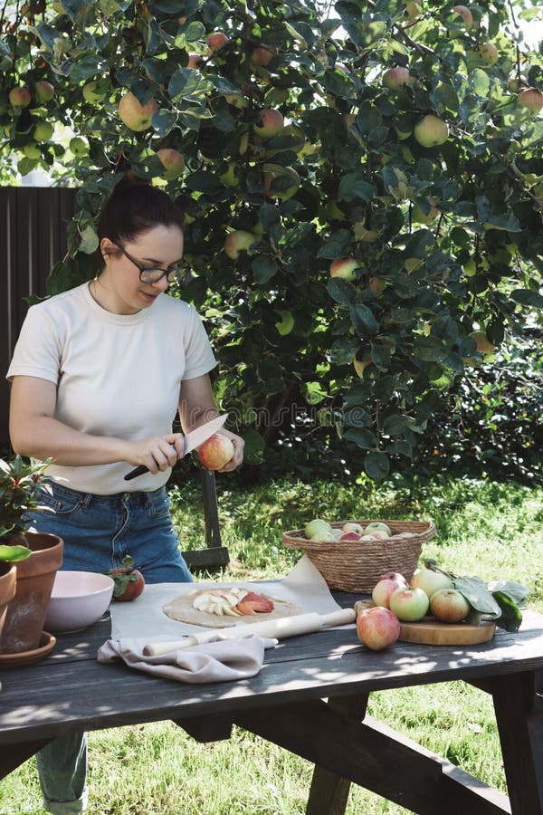 Woman in Glasses Picking Apples from a Tree and Cooking a Pie Stock ...