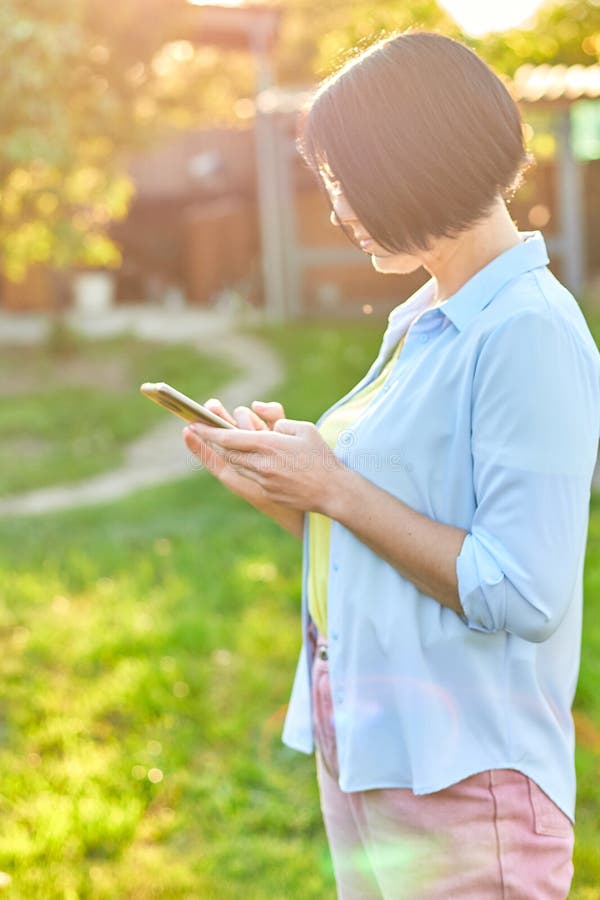 Woman in Glasses Using Smartphone, Type Messages on Mobile Phone Stock ... Woman in Glasses Using Smartphone, Type Messages on Mobile Phone Stock ...