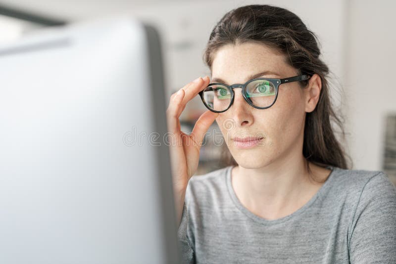 Woman with Glasses Working with a Computer Stock Image - Image of ...