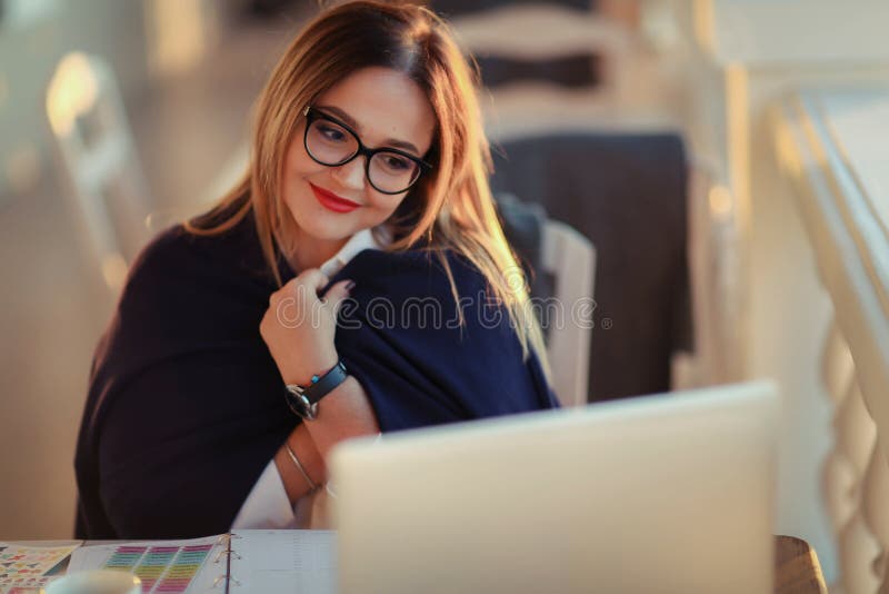 Woman in Glasses 45 Years Works in a Public Place at the Computer Stock ...