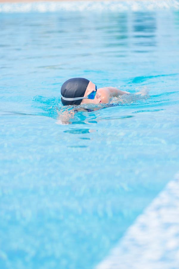Woman in Goggles Swimming Front Crawl Style Stock Image - Image of pool ...