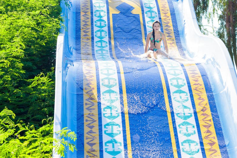 Woman Going Down a Water Slide Stock Image - Image of play, recreation ...