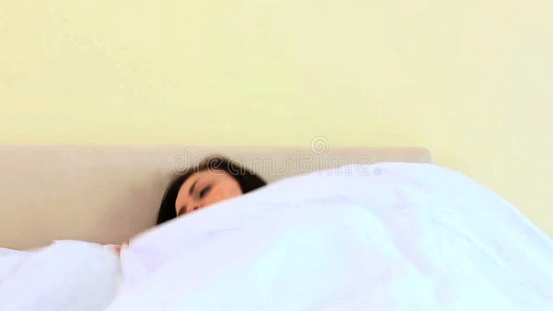 Woman going back to sleep stock footage. Video of resting - 42832728