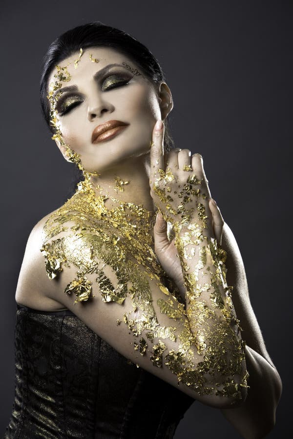 Woman in gold stock image. Image of posing, adult, glamor - 11400307