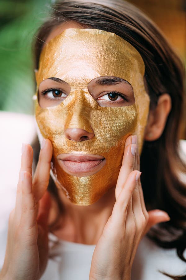 Woman with Gold Face Beauty Mask Stock Image - Image of freshness ...