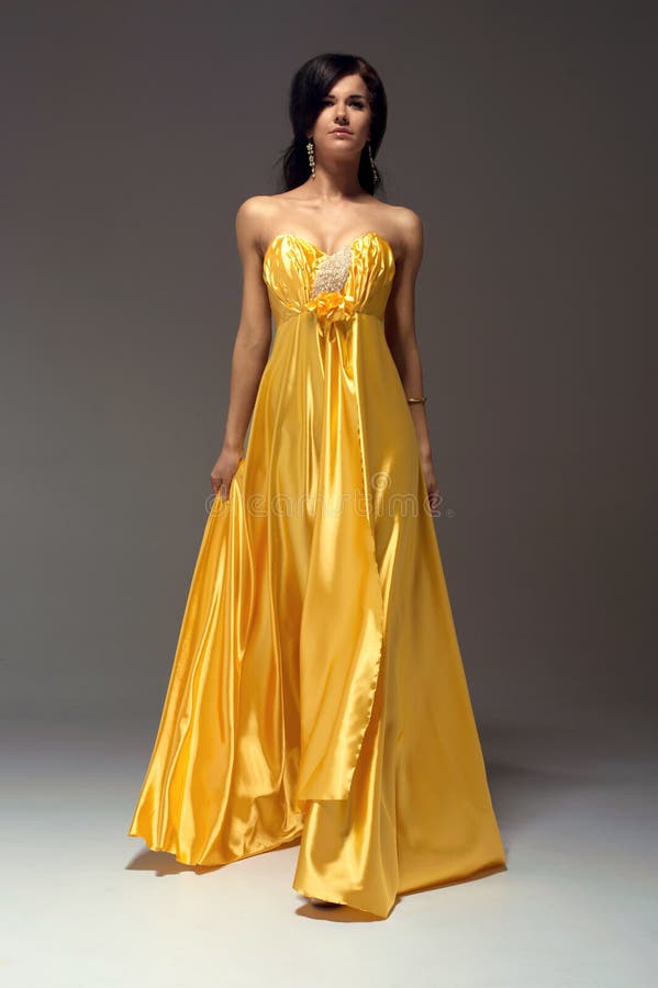 Woman in Golden Yellow Dress Stock Image - Image of contemporary ...