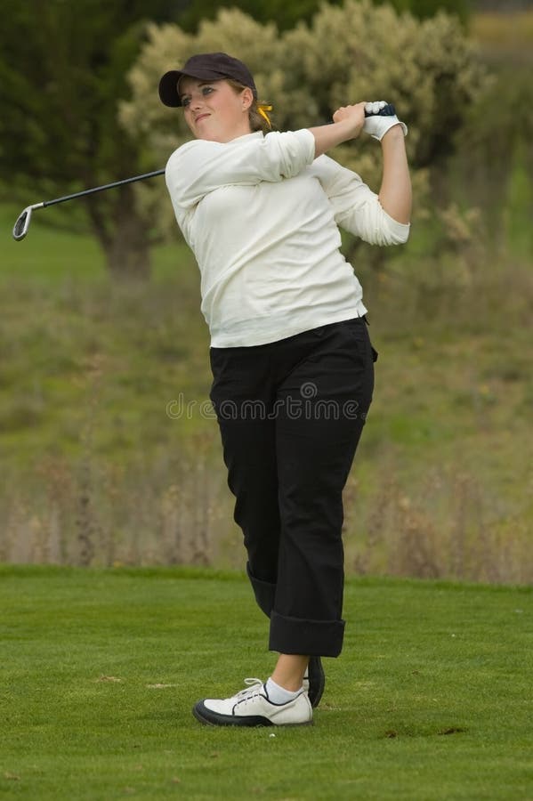 Woman golfer swinging club stock image. Image of leisure - 7004537