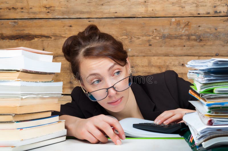 Woman Got Tired of Working and Studying Next To the Stack of Papaper ...