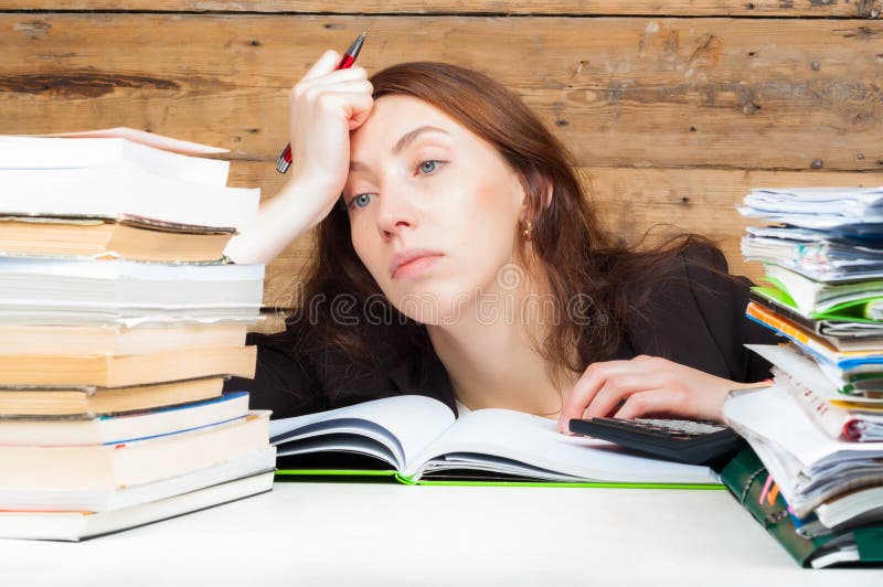 Woman Got Tired of Working and Studying Next To the Stack of Paper ...
