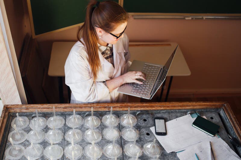 Woman Graduate Student Working on Laptop Computer in Biotechnology ...