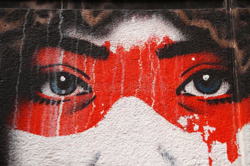Woman Graffiti Adorned with Face Paint on a Wall Stock Photo - Image of ...