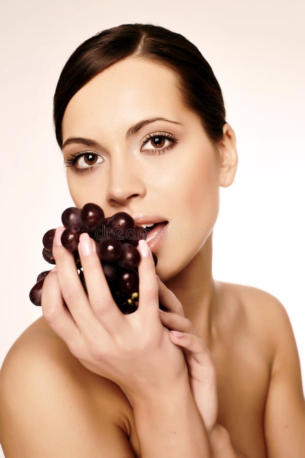 Woman with grape stock photo. Image of calories, bunch - 10575730