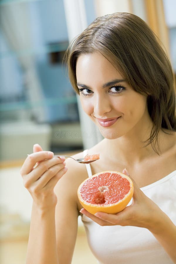 Woman with grapefruit stock photo. Image of smiling, female - 20754148