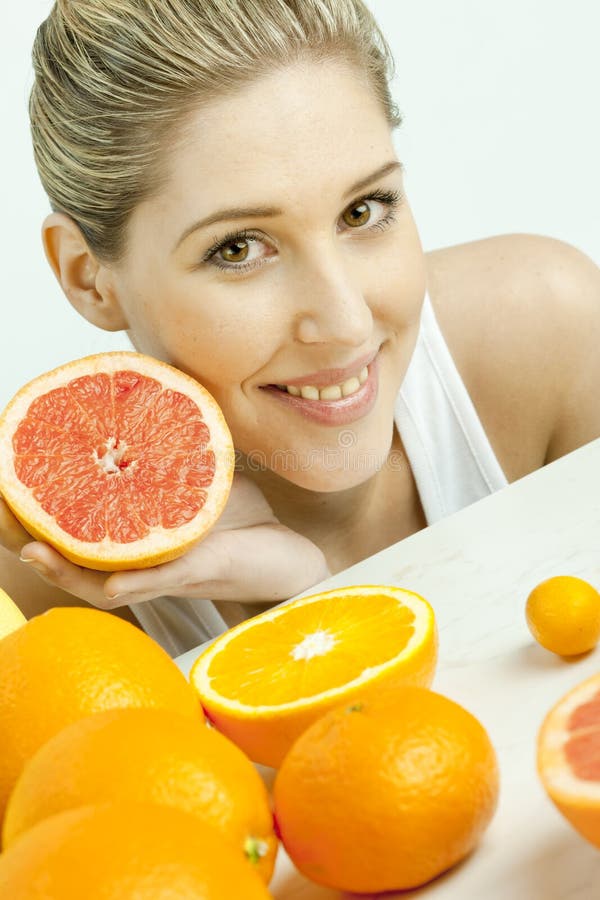 Woman with grapefruit stock image. Image of people, portrait - 28527079