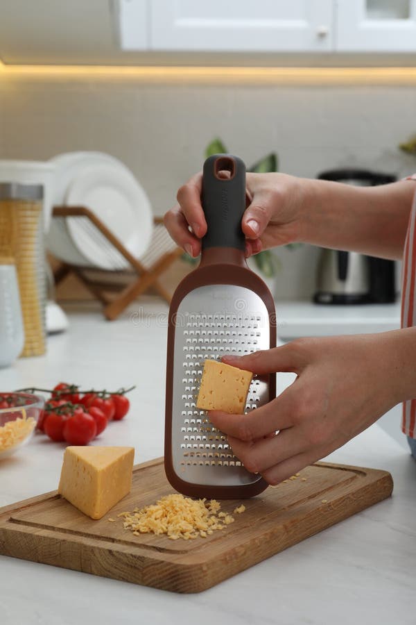 Woman Grating Cheese at Kitchen Counter, Closeup Stock Image - Image of ...