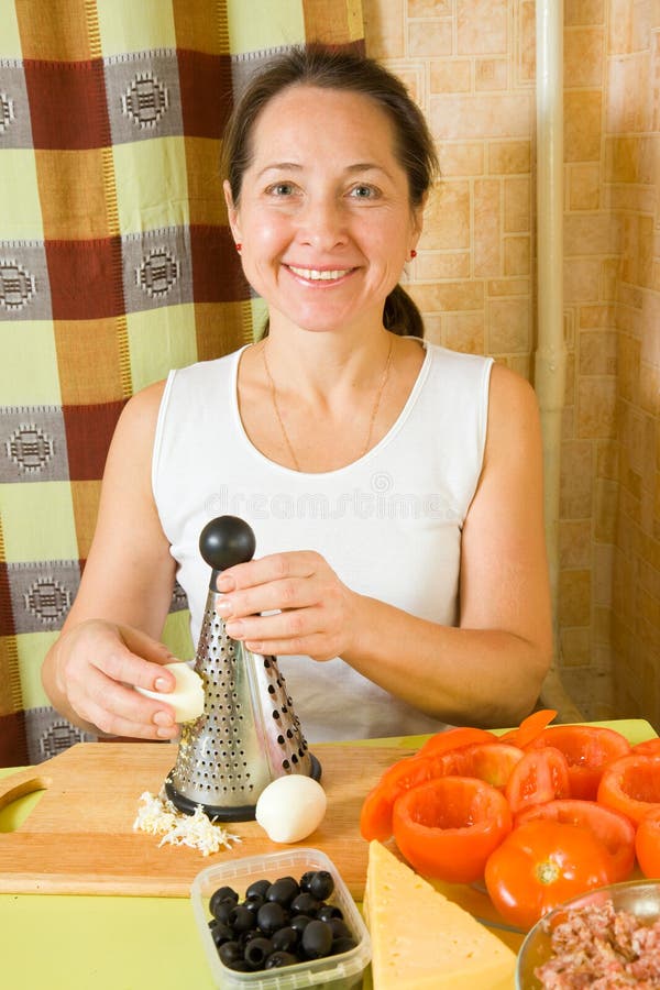 Woman grating eggs stock photo. Image of simple, stuffing - 17050396