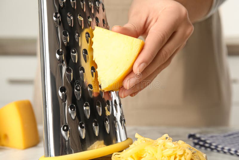 Woman Grating Fresh Cheese at Table Stock Photo - Image of kitchen ...