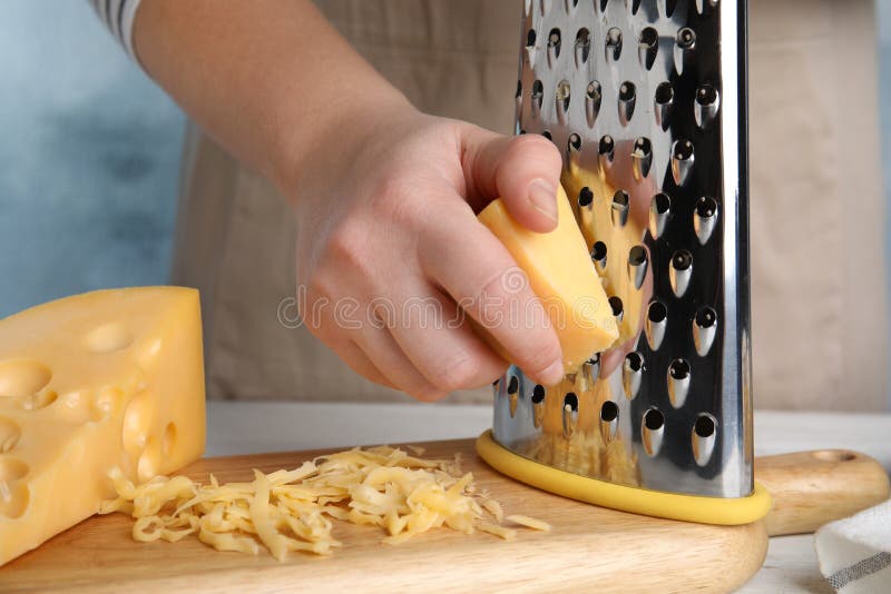 Woman Grating Fresh Cheese at Table, Closeup Stock Photo - Image of ...