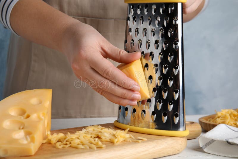 Woman Grating Fresh Cheese at Table Stock Image - Image of heap ...