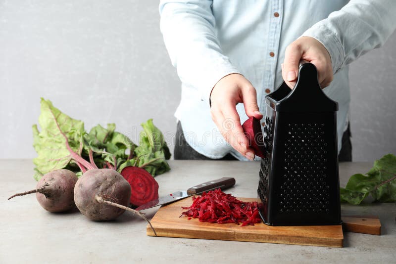 Woman Grating Fresh Red Beet at Table, Closeup Stock Photo - Image of ...