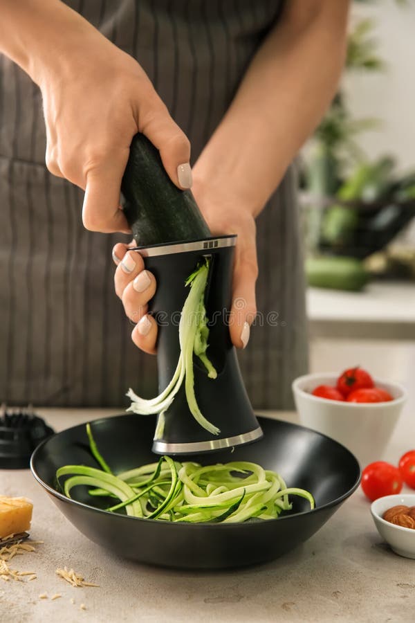 Woman Grating Zucchini in Kitchen Stock Photo - Image of closeup, green ...