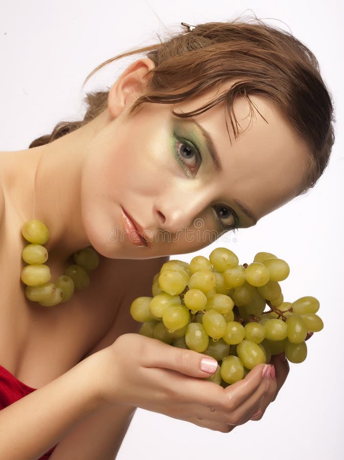 Woman with green grapes stock image. Image of female - 11168937