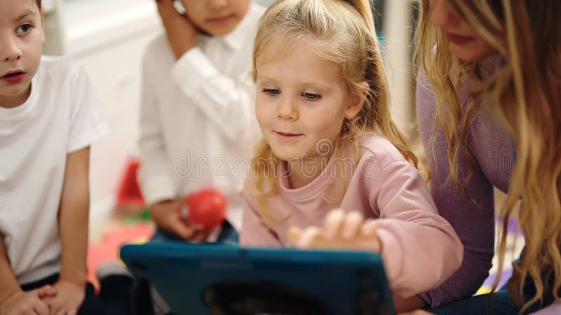 Woman and Group of Kids Having Lesson Using Touchpad at Kindergarten ...