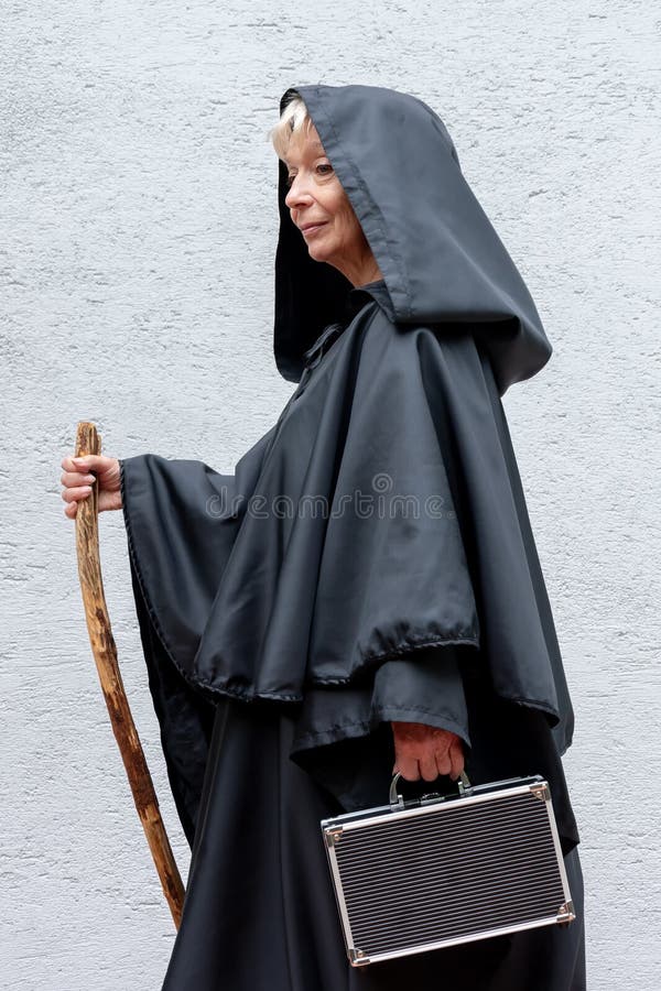 A Woman in the Guise of a Mystic or Witch with a Staff and a Case Stock ...