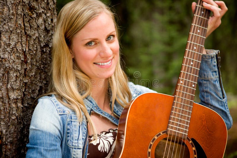 Woman with Guitar stock image. Image of happy, playing - 16261423