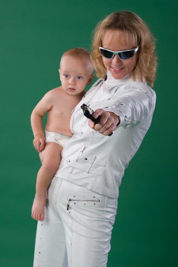 Woman with gun and son stock photo. Image of equilibrium - 3220216