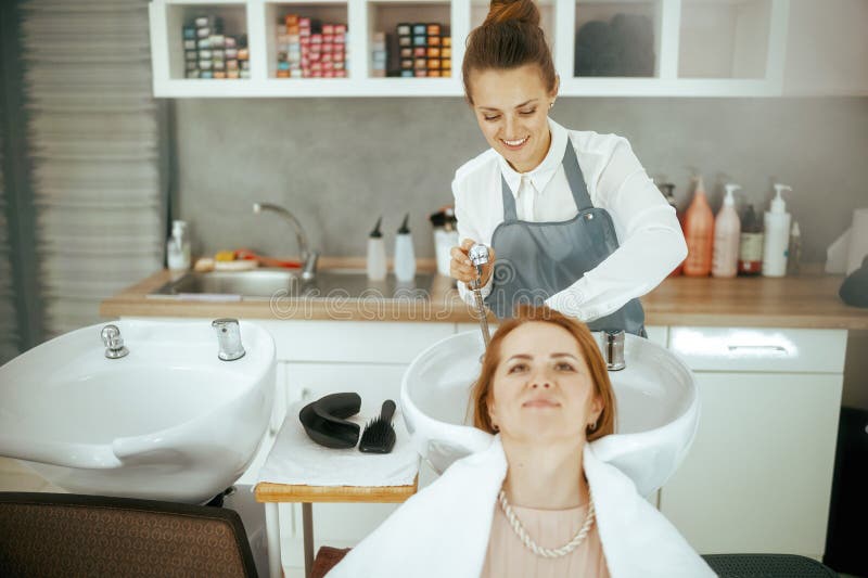 Woman Hair Salon Worker in Modern Hair Studio Washing Hair Stock Image ...